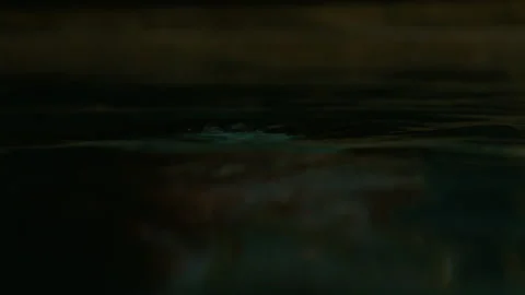 Woman looks at the camera while floating... | Stock Video | Pond5