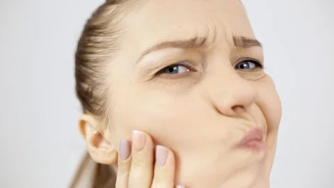 woman looks critically at the skin on he... | Stock Video | Pond5