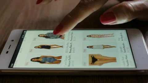 Woman looks at the goods in the online c... | Stock Video | Pond5