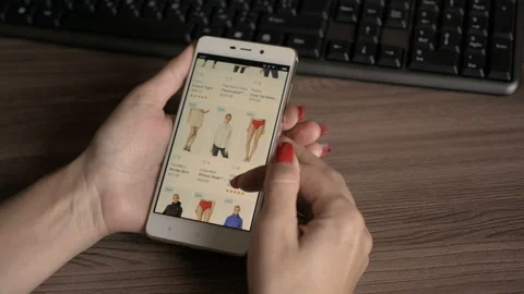 Woman looks at the goods in the online ... | Stock Video | Pond5