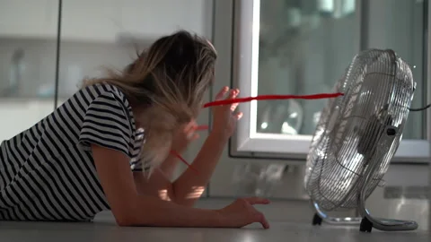 Woman lying on floor in front of electri... | Stock Video | Pond5