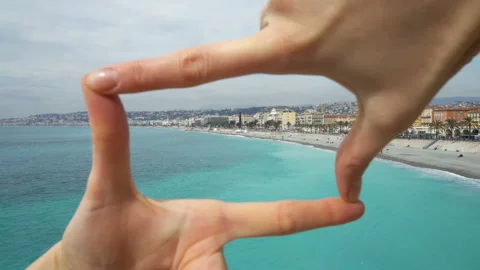 Woman makes a frame with fingers on the ... | Stock Video | Pond5