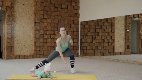 Woman makes wide step to side and crouch... | Stock Video | Pond5