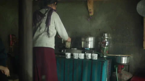 Woman making milk tea chai in Himalaya m... | Stock Video | Pond5