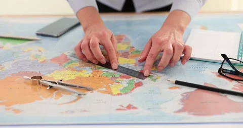 Woman measures distance between countrie... | Stock Video | Pond5