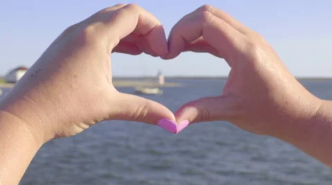 Woman (On A Moving Boat) Creates A Heart... | Stock Video | Pond5
