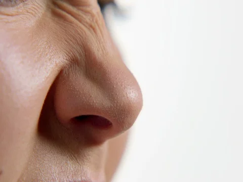 Woman moving her nose | Stock Video | Pond5