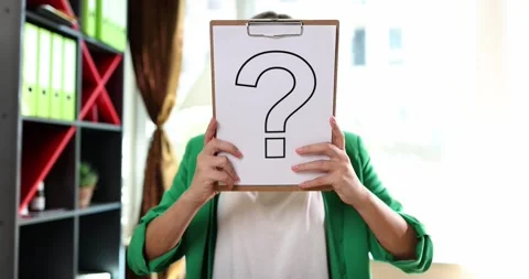 A woman in the office holds a question m... | Stock Video | Pond5