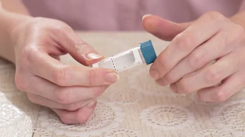 a woman open a tube to collect saliva fo... | Stock Video | Pond5