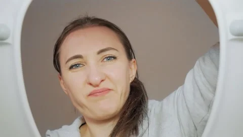 Woman opening lid leaning over toilet in... | Stock Video | Pond5