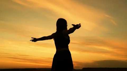 Woman with outstretched hands turning ar... | Stock Video | Pond5