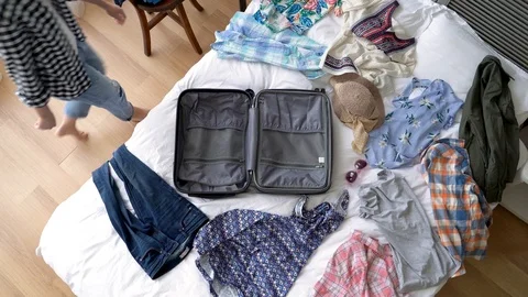 woman packing up her luggage | Stock Video | Pond5