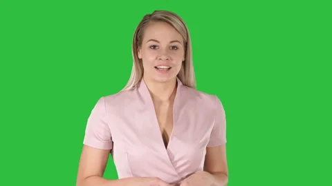 Woman in pink talking to the camera on a... | Stock Video | Pond5