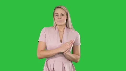 Woman in pink talking to the camera on a... | Stock Video | Pond5