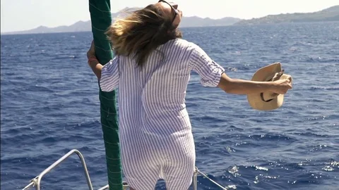 Woman playing with hair, enjoying sailin... | Stock Video | Pond5