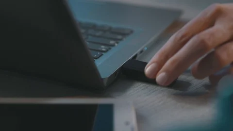 Woman plugging a USB flash drive into a ... | Stock Video | Pond5
