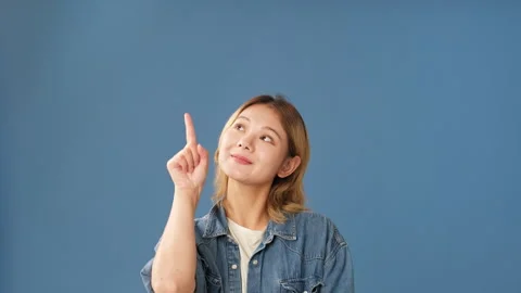 Woman pointing with finger up at mockup ... | Stock Video | Pond5