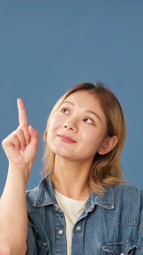Woman pointing with finger up at mockup ... | Stock Video | Pond5