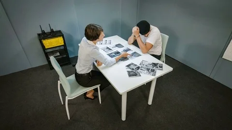 Woman police officer interrogating man a... | Stock Video | Pond5