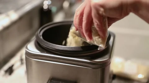 Woman Pouring Rice Into Rice Cooker In S... | Stock Video | Pond5