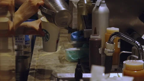 Woman pours warm milk into large cup and... | Stock Video | Pond5