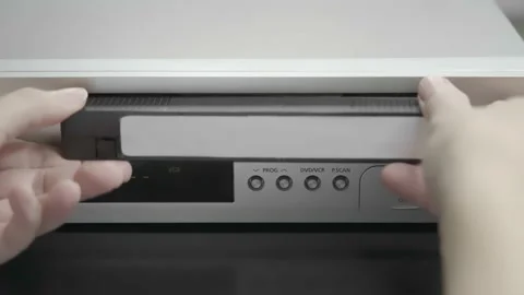 woman pull out VHS cassette from VCR. Vi... | Stock Video | Pond5