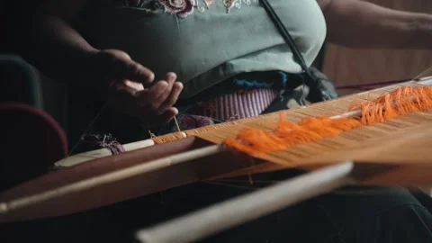 Woman Pulling and Raising Thread in Trad... | Stock Video | Pond5