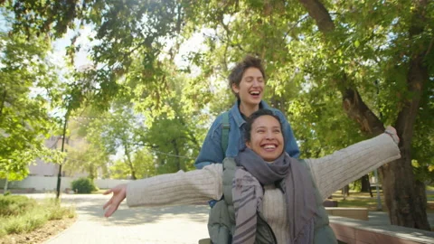 Woman Pushing Excited Friend in Wheelcha... | Stock Video | Pond5