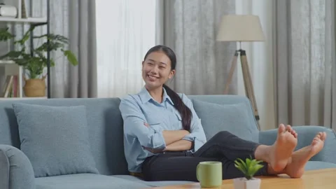 Woman Puts Feet On Wooden Table Resting ... | Stock Video | Pond5