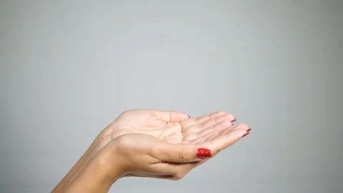 Woman raising two empty open palms isola... | Stock Video | Pond5