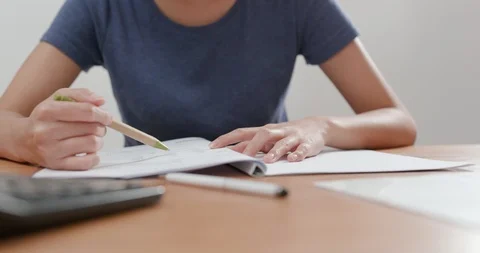 Woman read on note at home | Stock Video | Pond5
