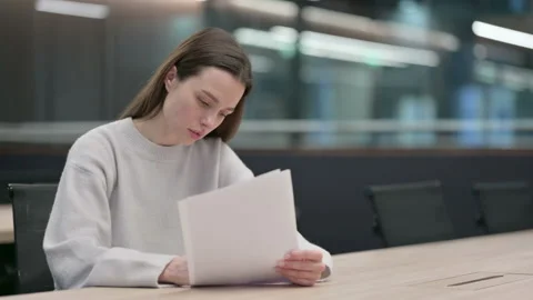 Woman Reading and Writing on Paper | Stock Video | Pond5