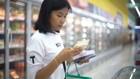 Woman reading food label with ingredient... | Stock Video | Pond5