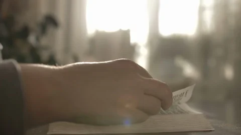 woman reads a book turns over the pages,... | Stock Video | Pond5