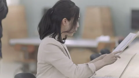 Woman receiving documents from colleague... | Stock Video | Pond5