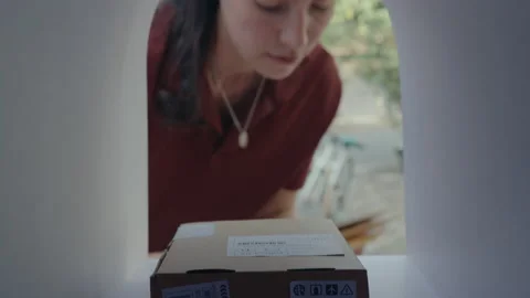 Woman Receiving Letters and Parcel out o... | Stock Video | Pond5