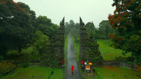 A woman in a red dress walks barefoot to... | Stock Video | Pond5
