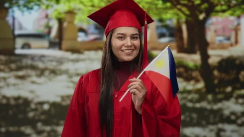 Woman in red graduation gown holding phi... | Stock Video | Pond5