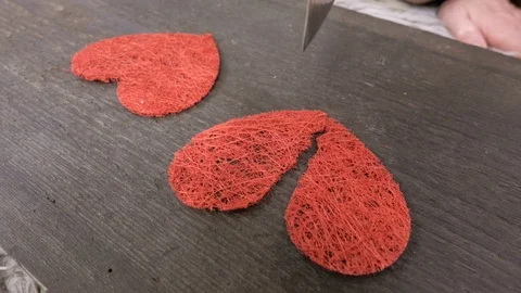 Woman red heart shape stab with a knife.... | Stock Video | Pond5