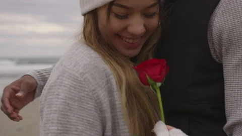 Woman with a Red Rose Hugs Her Boyfriend... | Stock Video | Pond5