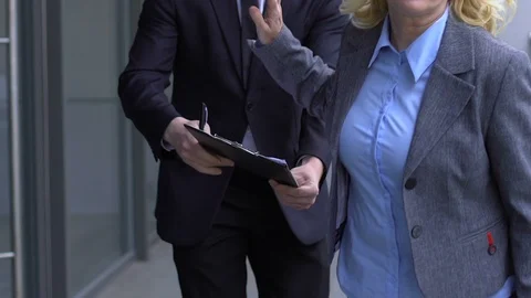 Woman refuses to sign documents, hurries... | Stock Video | Pond5