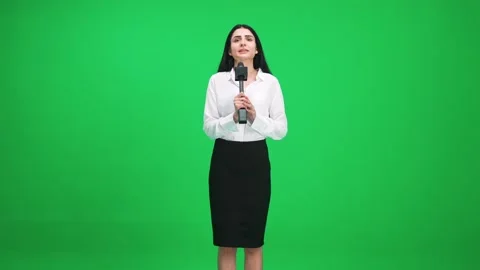 Woman reporter in suit looks into the ca... | Stock Video | Pond5