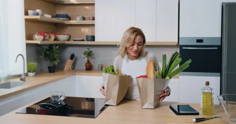 Woman return from supermarket with shopp... | Stock Video | Pond5