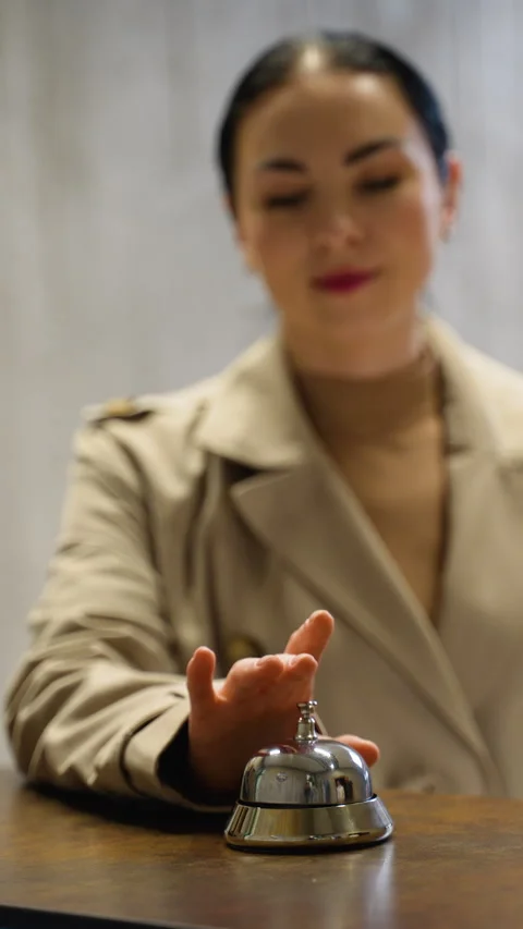 Woman ringing hotel service bell at rece... | Stock Video | Pond5