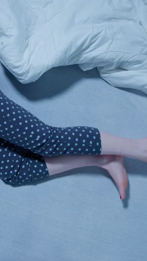 Woman With RLS - Restless Legs Syndrome | Stock Video | Pond5