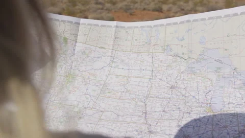 Woman on Road Trip Checking Map | Stock Video | Pond5
