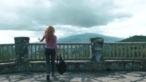 Woman is running to a viewpoint. Redhead... | Stock Video | Pond5