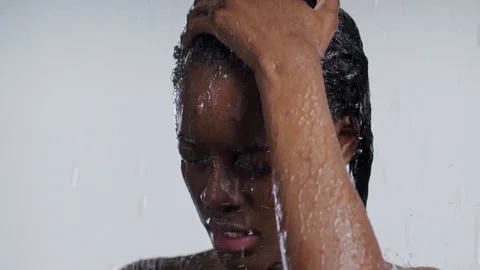 Woman runs her hands through her hair as... | Stock Video | Pond5