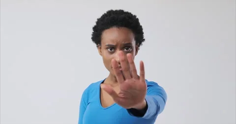 Woman saying no with stop hand sign | Stock Video | Pond5