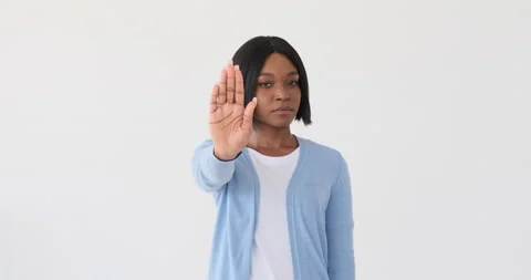 Woman saying no with stop hand sign | Stock Video | Pond5